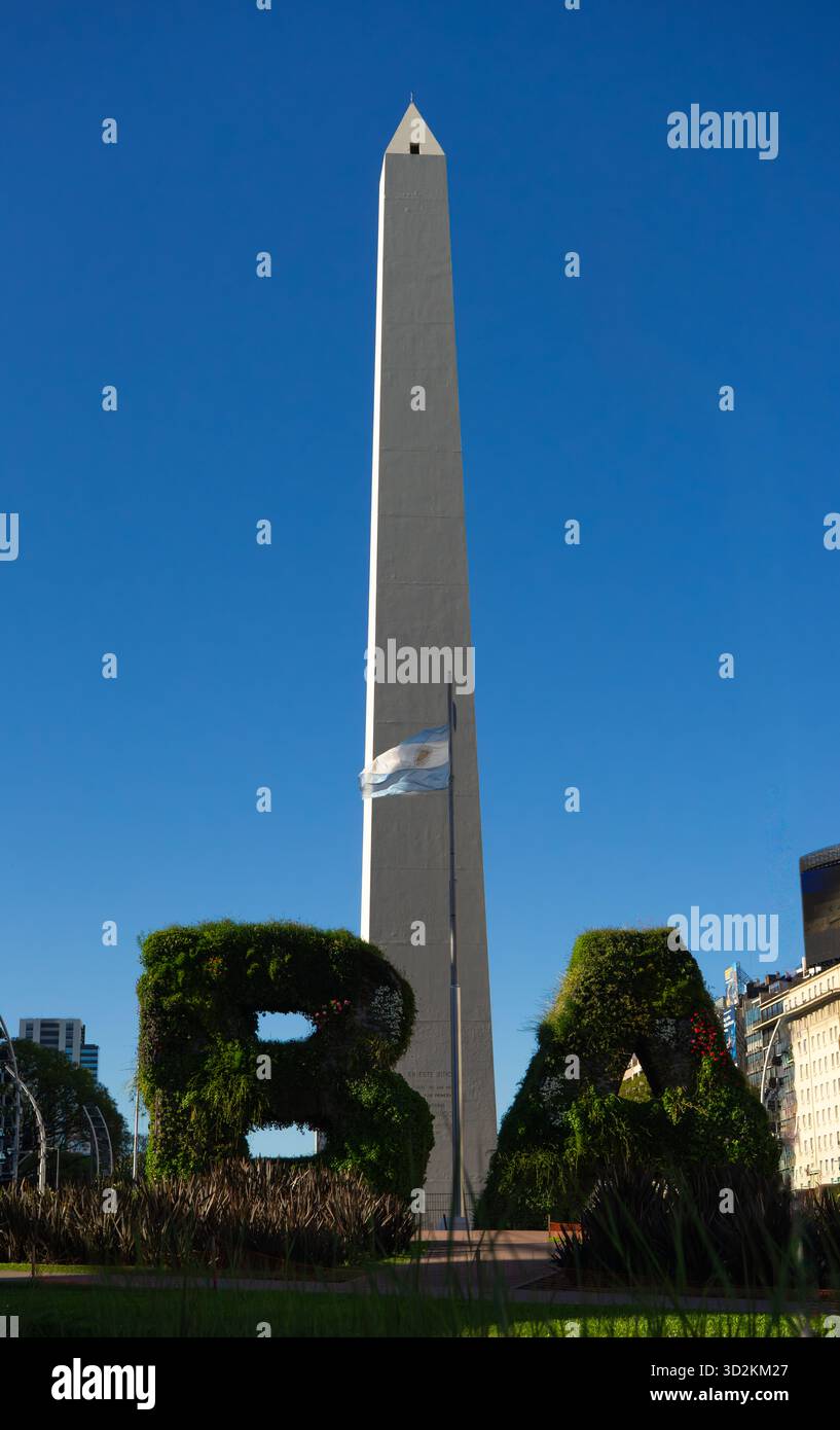 Obelisco with BA topiary and Argentina flag Stock Photo - Alamy