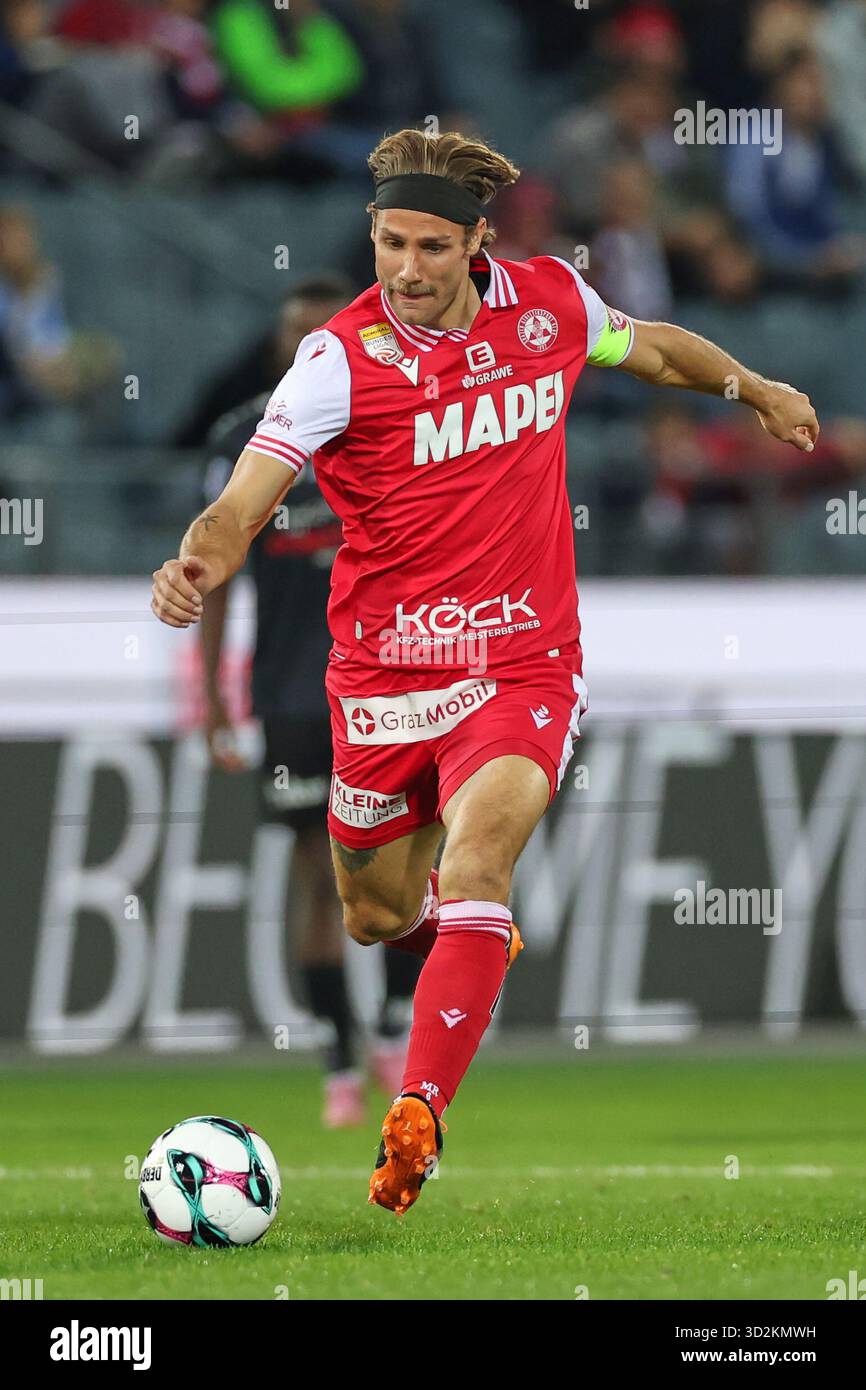 Austrian Bundesliga football match between Grazer AK 1902 and SCR Altach. Dynamic game moments ...