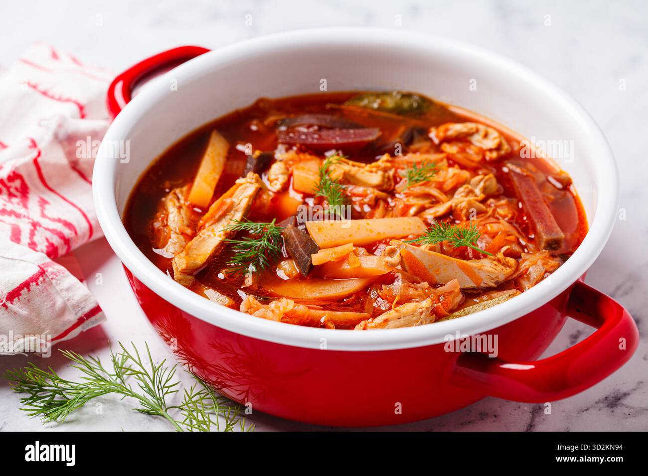 Classic homemade borscht with chicken in a red pot Stock Photo - Alamy