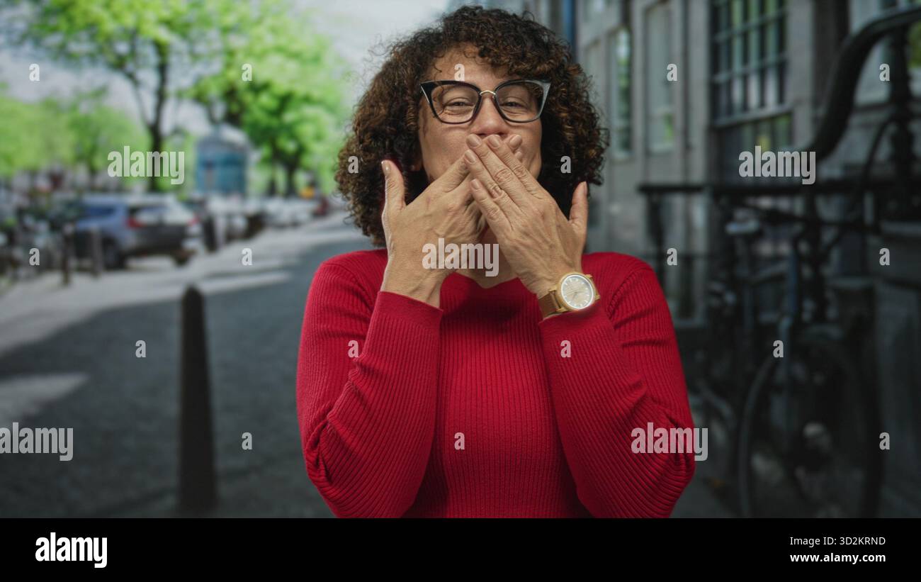 Woman touches lips index finger hi-res stock photography and images - Alamy