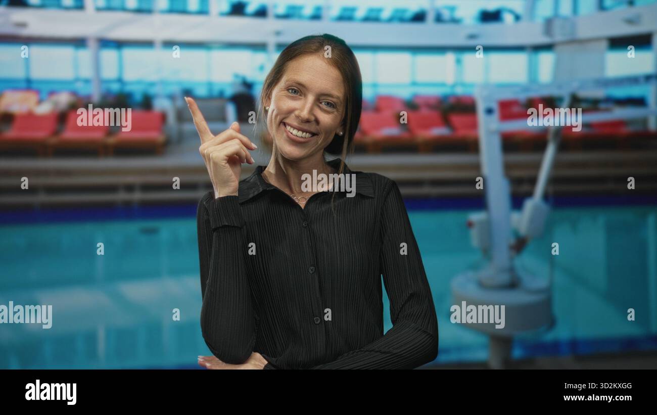 Woman points finger chin indoor hi-res stock photography and images - Alamy