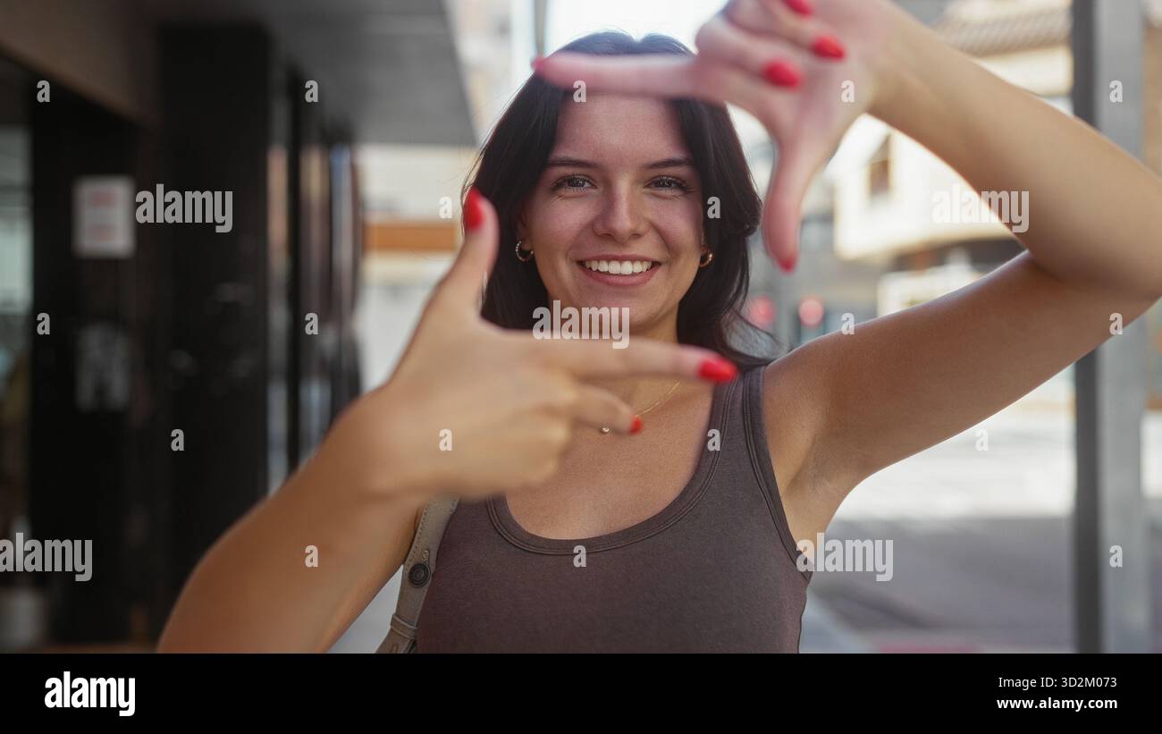 Woman framing hands rectangle smiling hi-res stock photography and ...