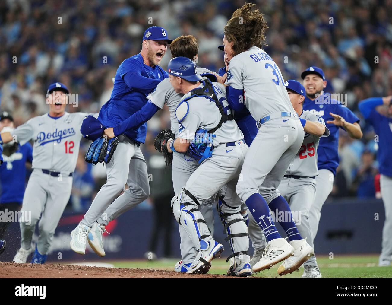 The Los Angeles Dodgers celebrate after defeating the Toronto Blue Jays ...