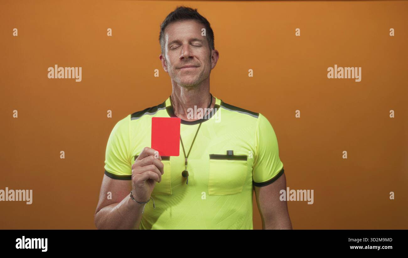 Referee man holds red hi-res stock photography and images - Alamy