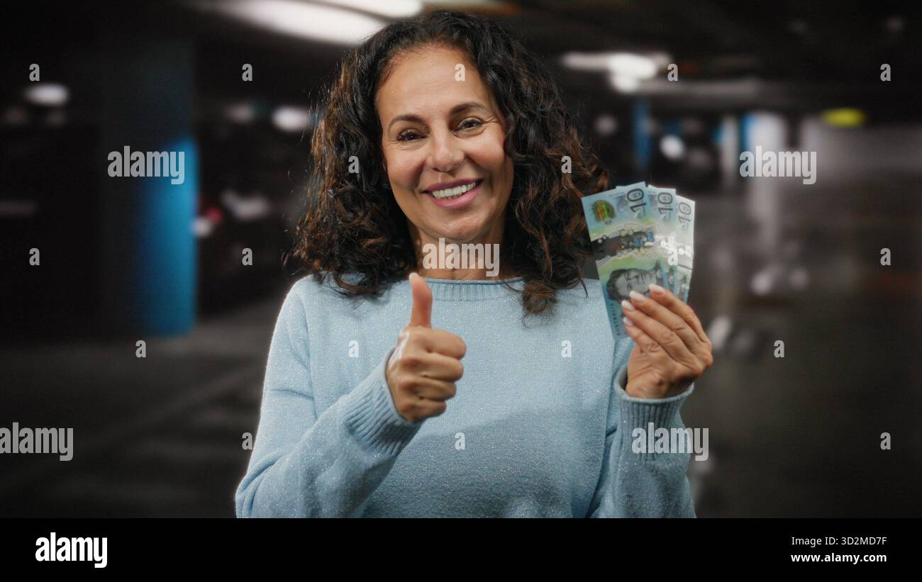 Middle aged woman holds australian hi-res stock photography and images ...