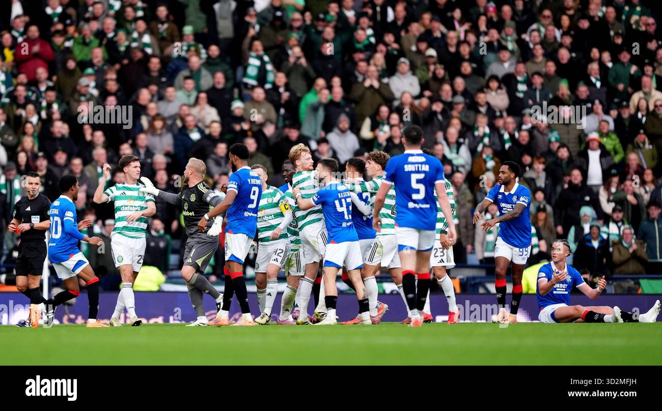 Celtic goalkeeper Kasper Schmeichel separates Celtic's Johnny Kenny and ...