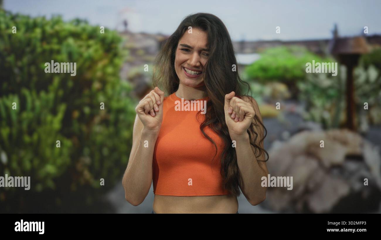 Woman scrunches face holds arms hi-res stock photography and images - Alamy