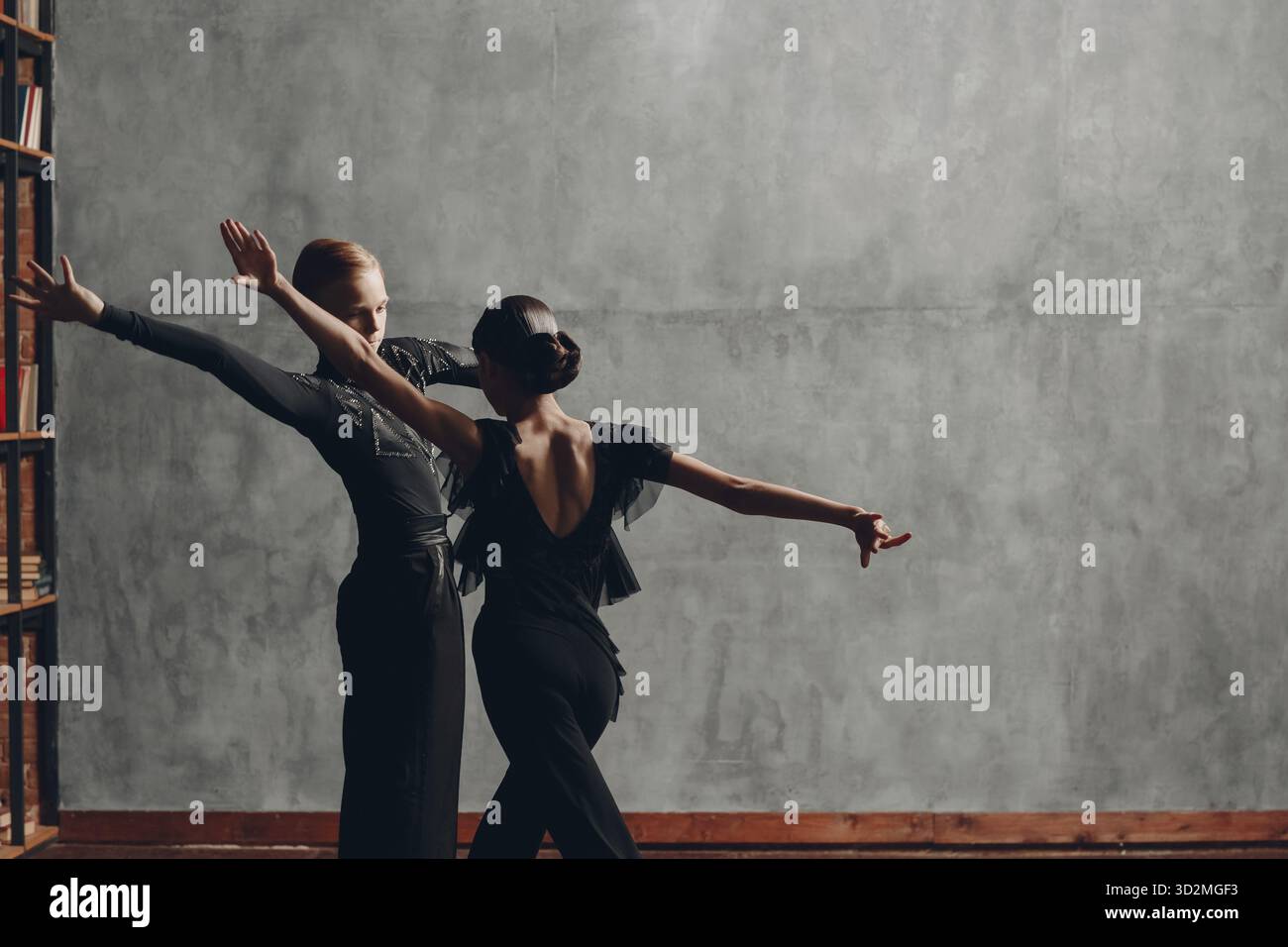 Young couple dancers dancing ballroom dance Paso doble Stock Photo - Alamy
