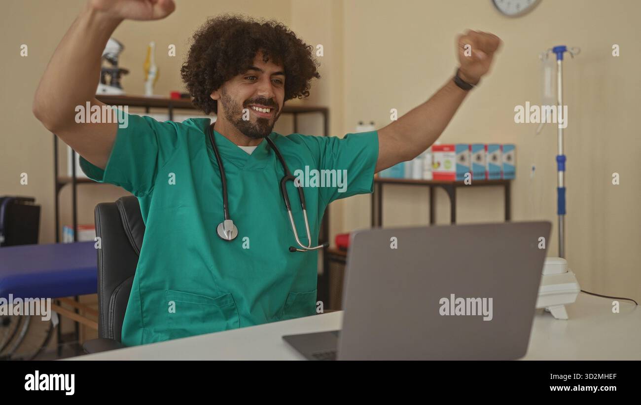 Man doctor with curly hair wearing stethoscope claps hands at laptop ...