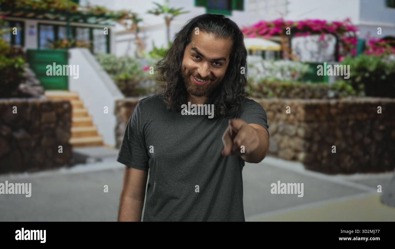 Young arab hispanic man points hi-res stock photography and images - Alamy