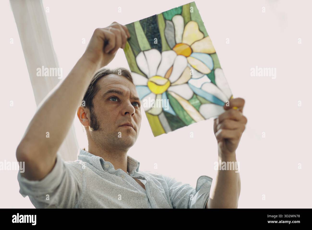 Restorer master male checking stained glass window project Stock Photo ...
