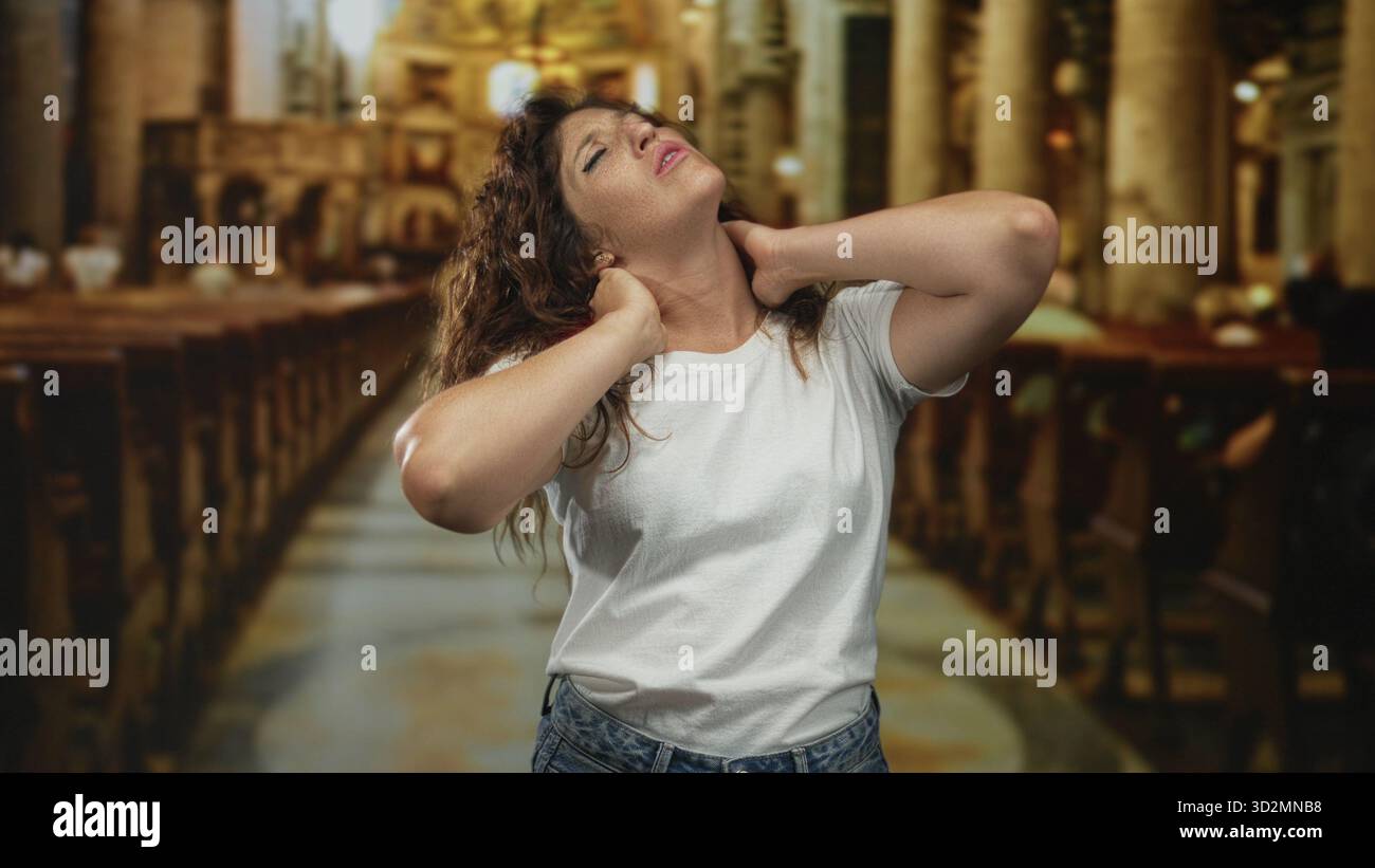 Woman clutching neck tilting head hi-res stock photography and images ...