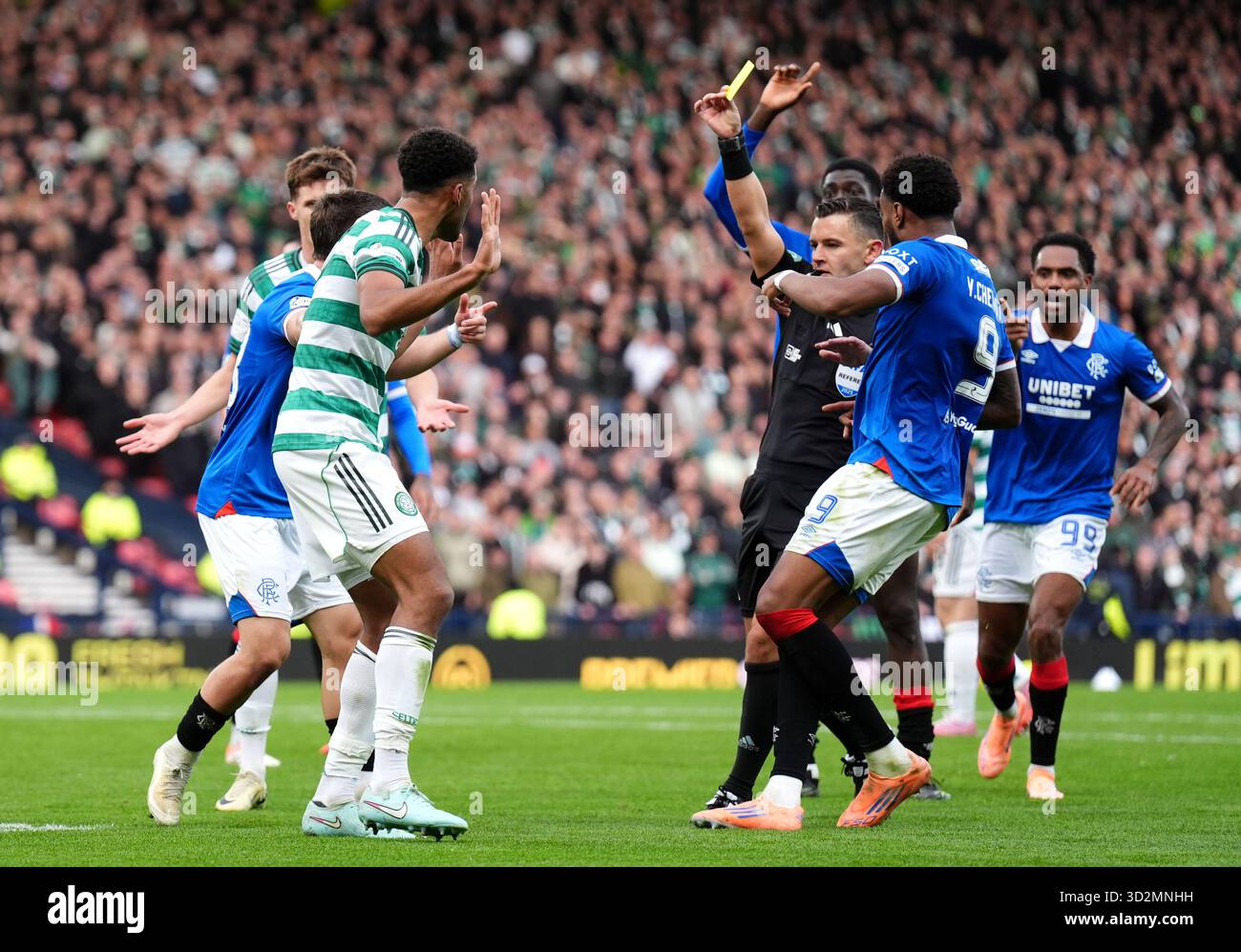 Celtic's Auston Trusty is shown a yellow card by referee Nick Walsh ...