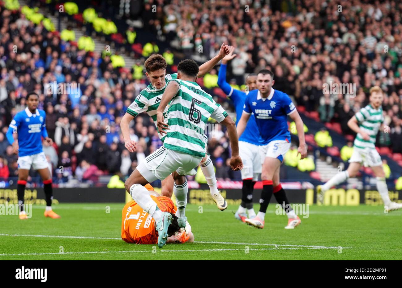 Celtic's Auston Trusty fouls Rangers goalkeeper Jack Butland, resulting ...