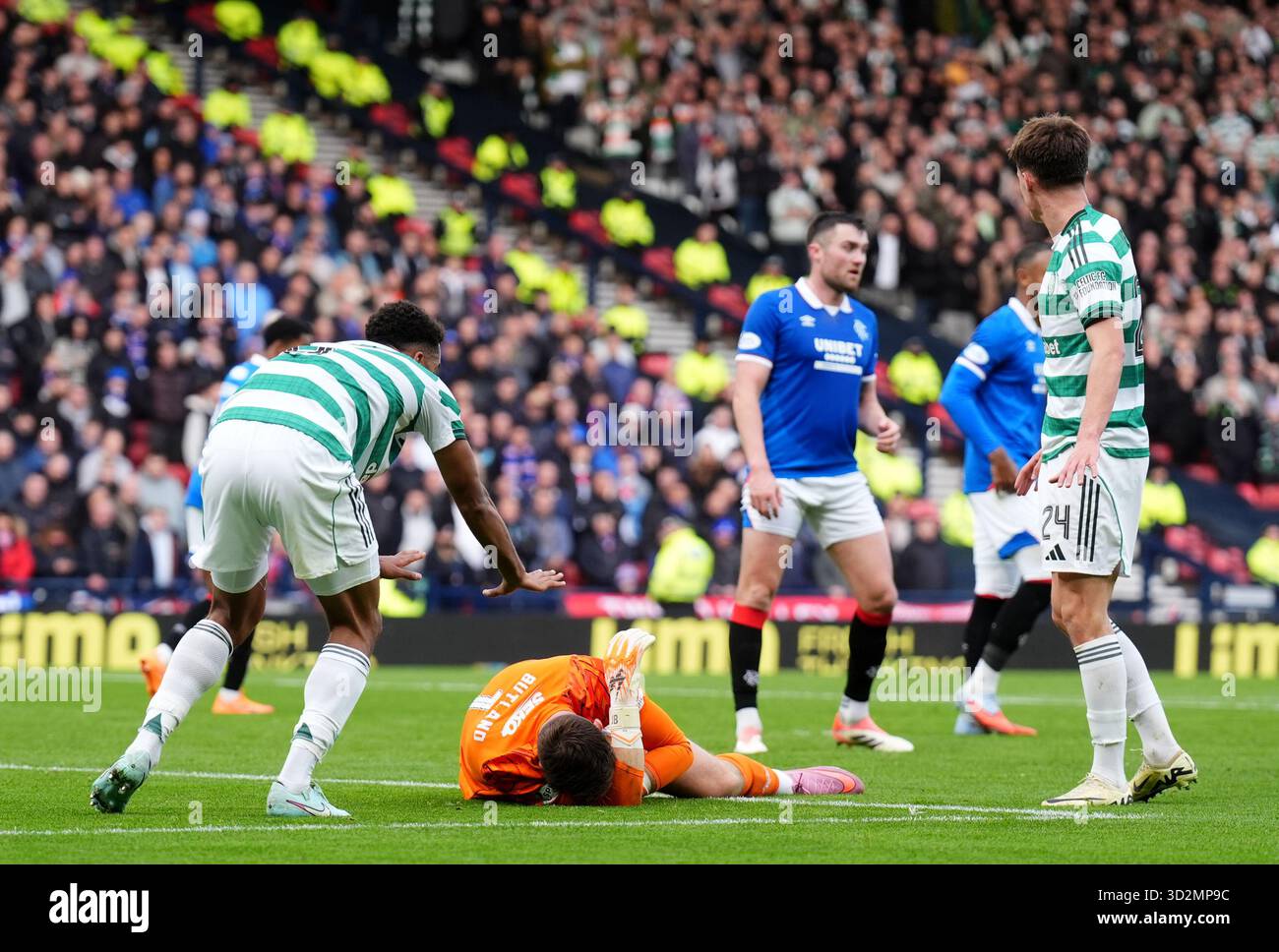 Celtic's Auston Trusty fouls Rangers goalkeeper Jack Butland, resulting ...