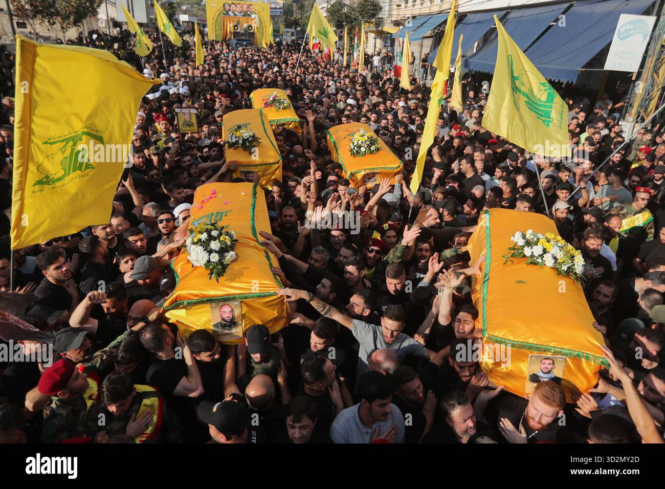 Mourners carry the coffins of five Hezbollah killed in Israeli strikes ...