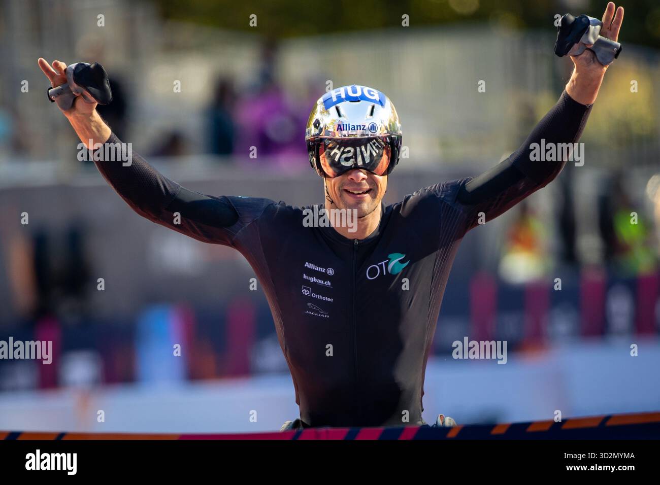 Marcel Hug of Sweden crosses the finish line to win the men's ...
