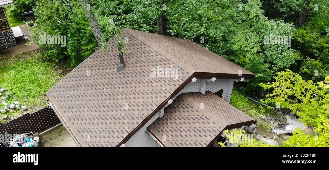 Bituminous tile for a roof. a roof from a bituminous tile Stock Photo ...