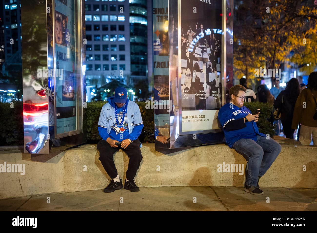 Baseball fans sit downtown following World Series Game 7 between the ...