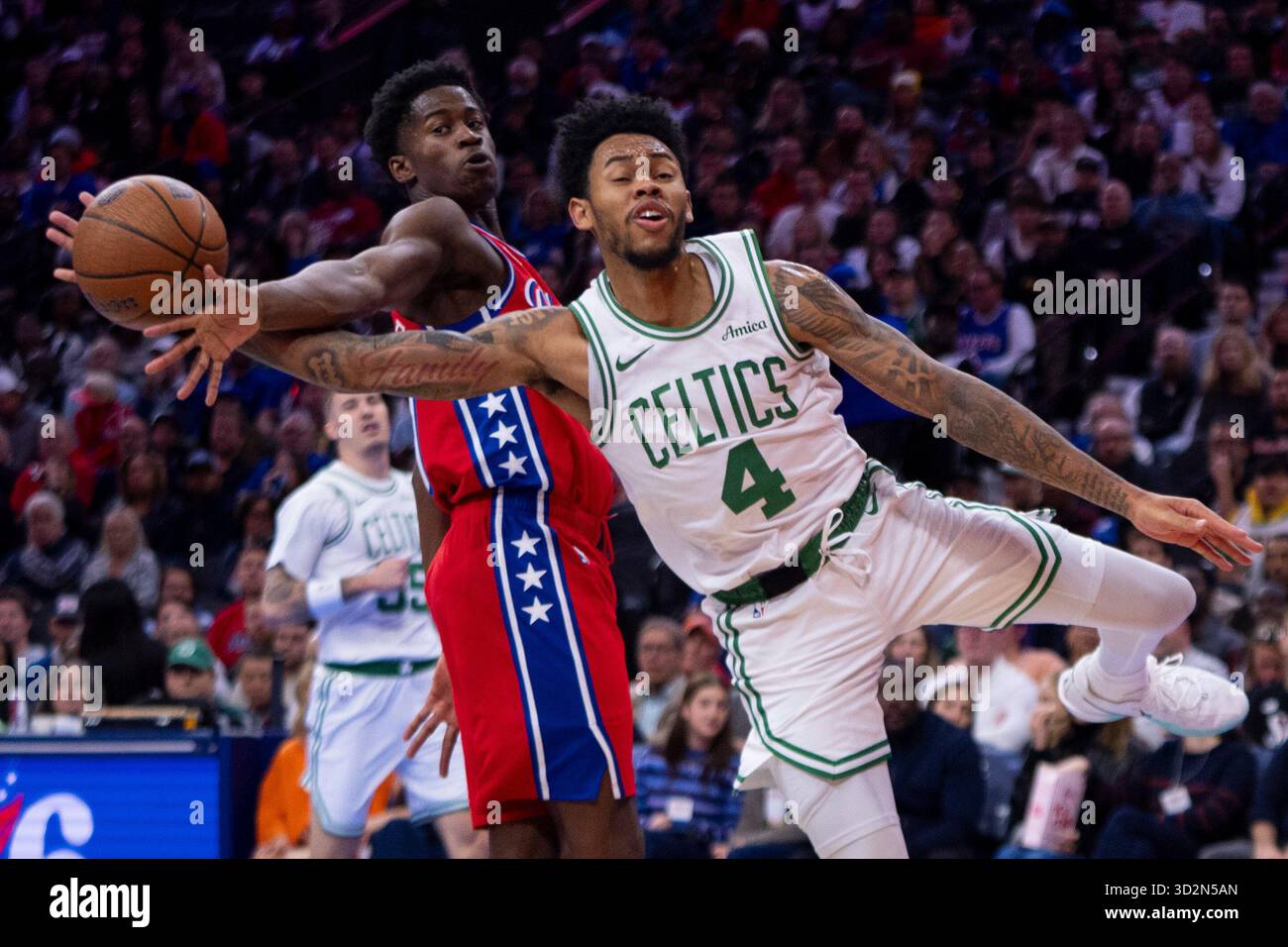 Boston Celtics' Anfernee Simons, right, gets fouled by Philadelphia ...