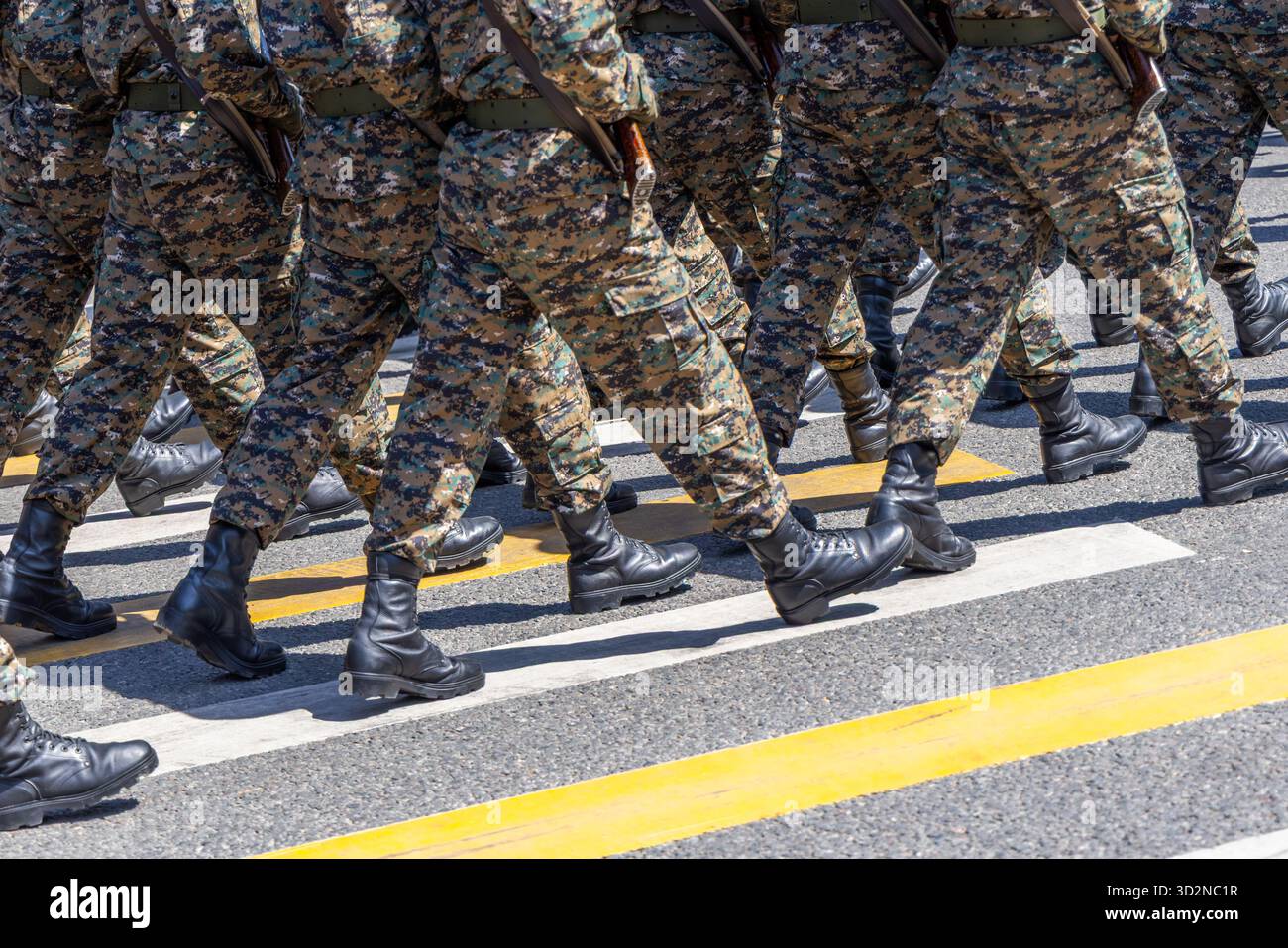 Group of soldiers marching in camouflage uniforms outdoors Stock Photo ...