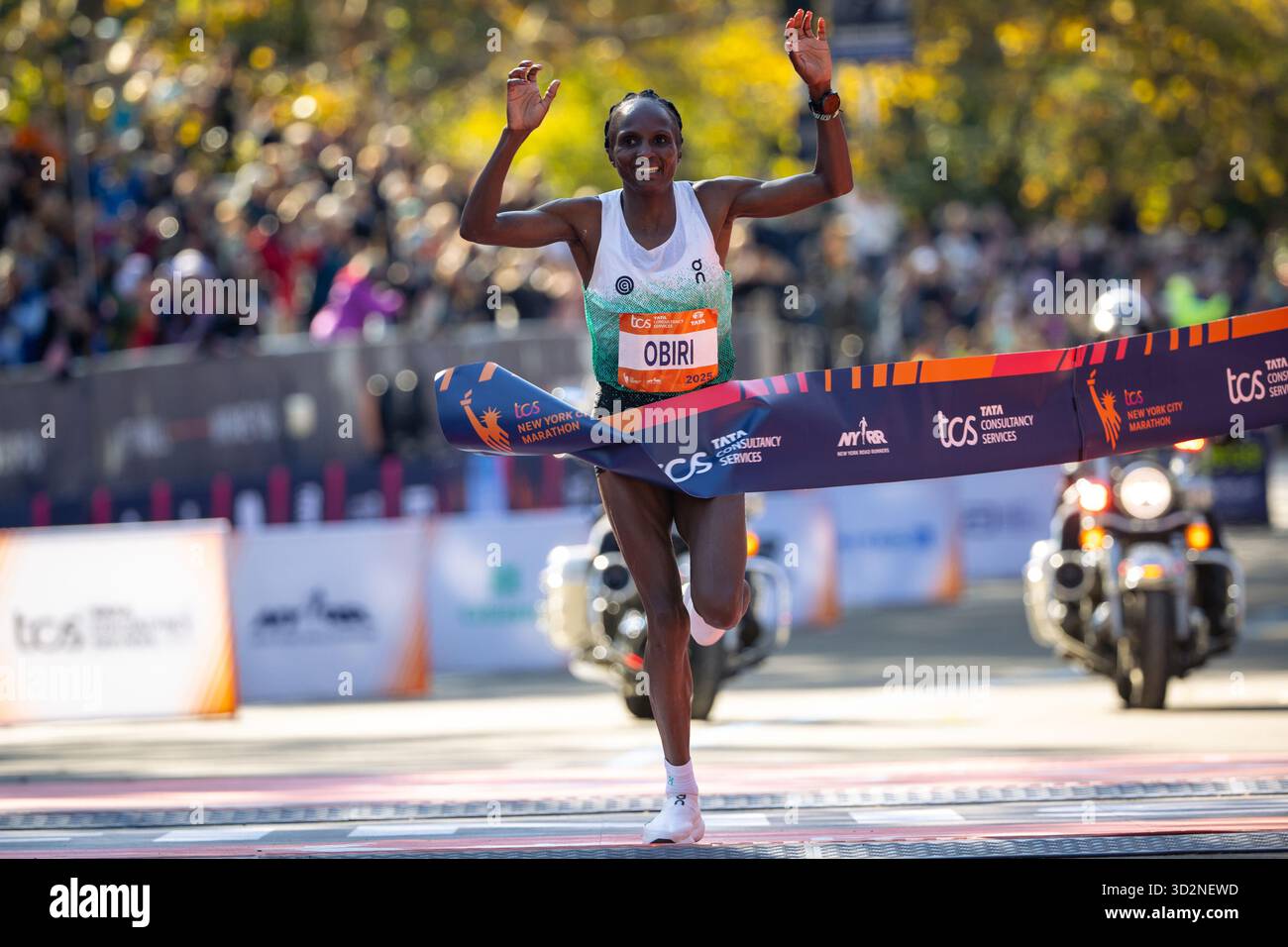 Hellen Obiri crosses the finish line to win the women's elite division ...