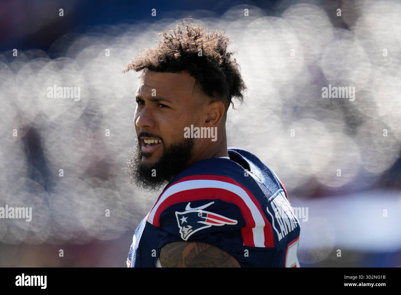 New England Patriots linebacker Harold Landry III warms up before an ...