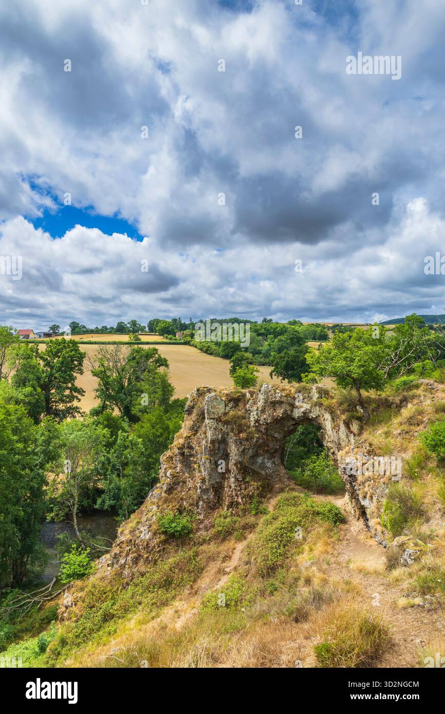 Natural rock arch forming a bridge over the Cousin river in Bourgogne ...