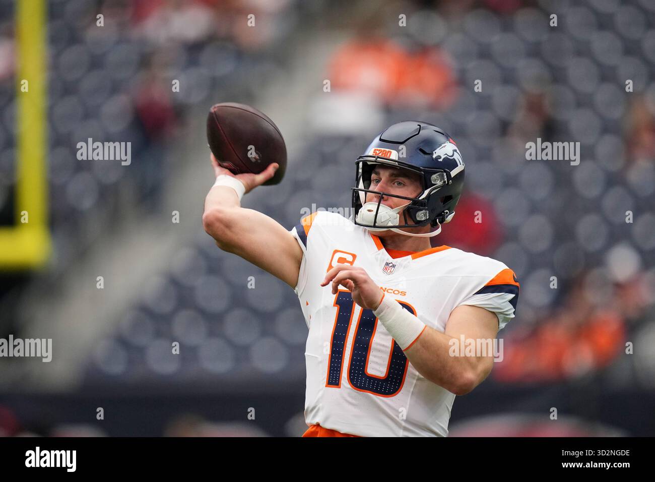 Denver Broncos quarterback Bo Nix warms up before an NFL football game ...