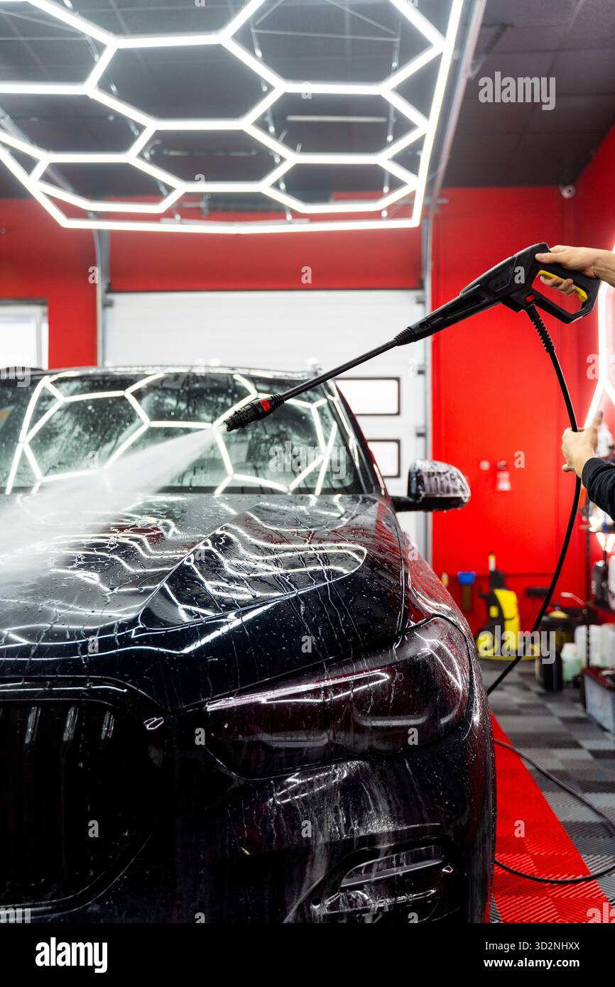 Foam car wash coats the vehicle body to lift dirt and grime while ...