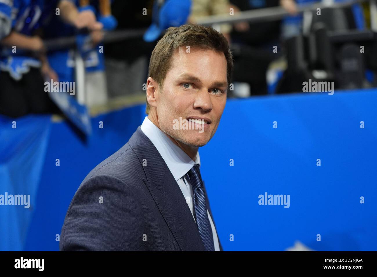 Former NFL player Tom Brady stands on the field before an NFL football ...
