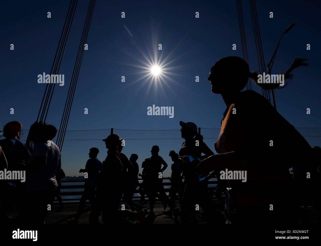 Runners cross over the span of Verrazzano-Narrows Bridge when they ...
