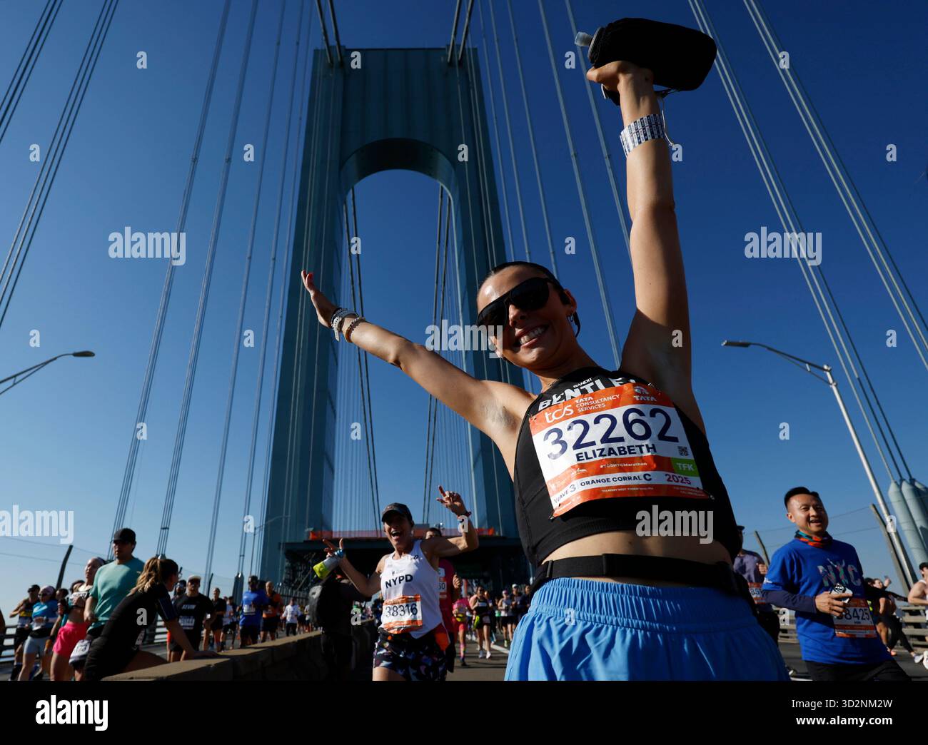 Runners cross over the span of Verrazzano-Narrows Bridge when they ...
