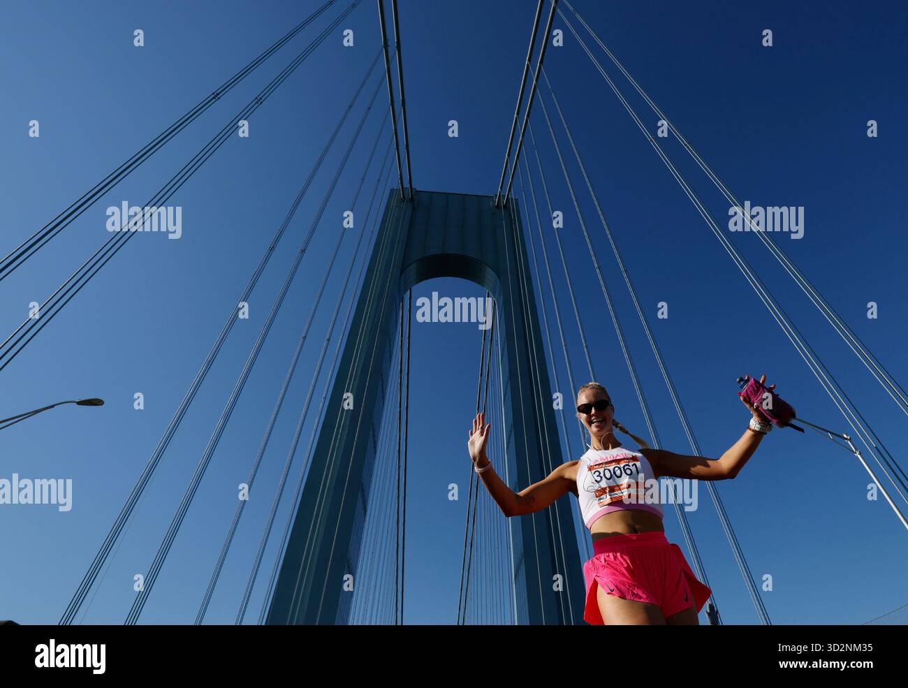 Runners cross over the span of Verrazzano-Narrows Bridge when they ...