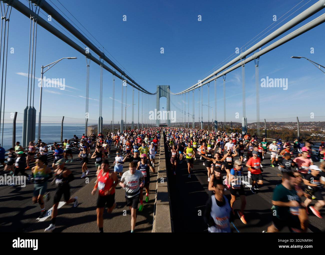 Runners cross over the span of Verrazzano-Narrows Bridge when they ...