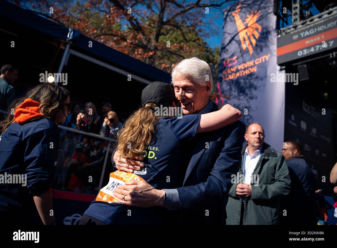 Former President Bill Clinton hugs his daughter, Chelsea Clinton, after ...