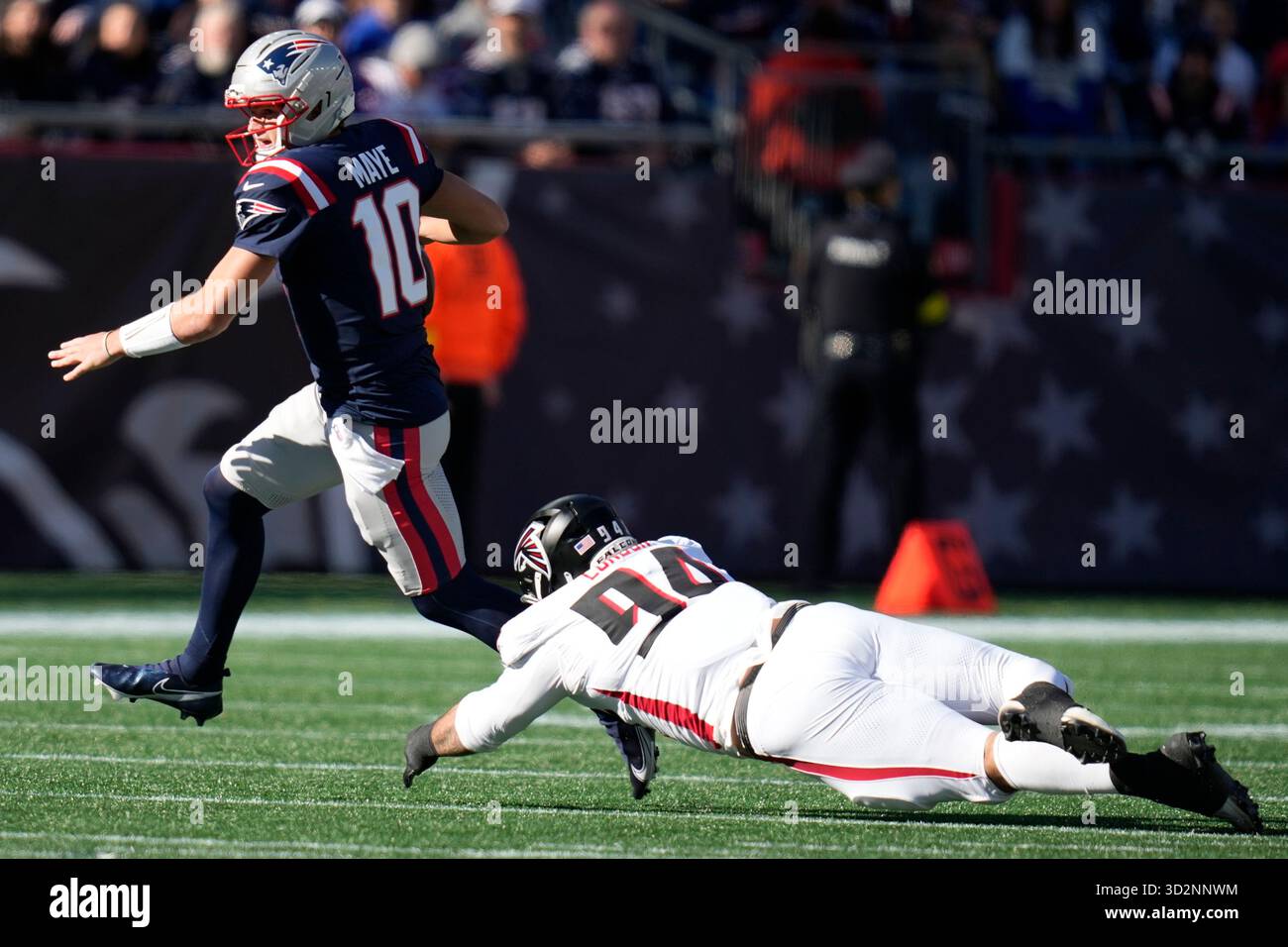 New England Patriots quarterback Drake Maye (10) runs past Atlanta ...