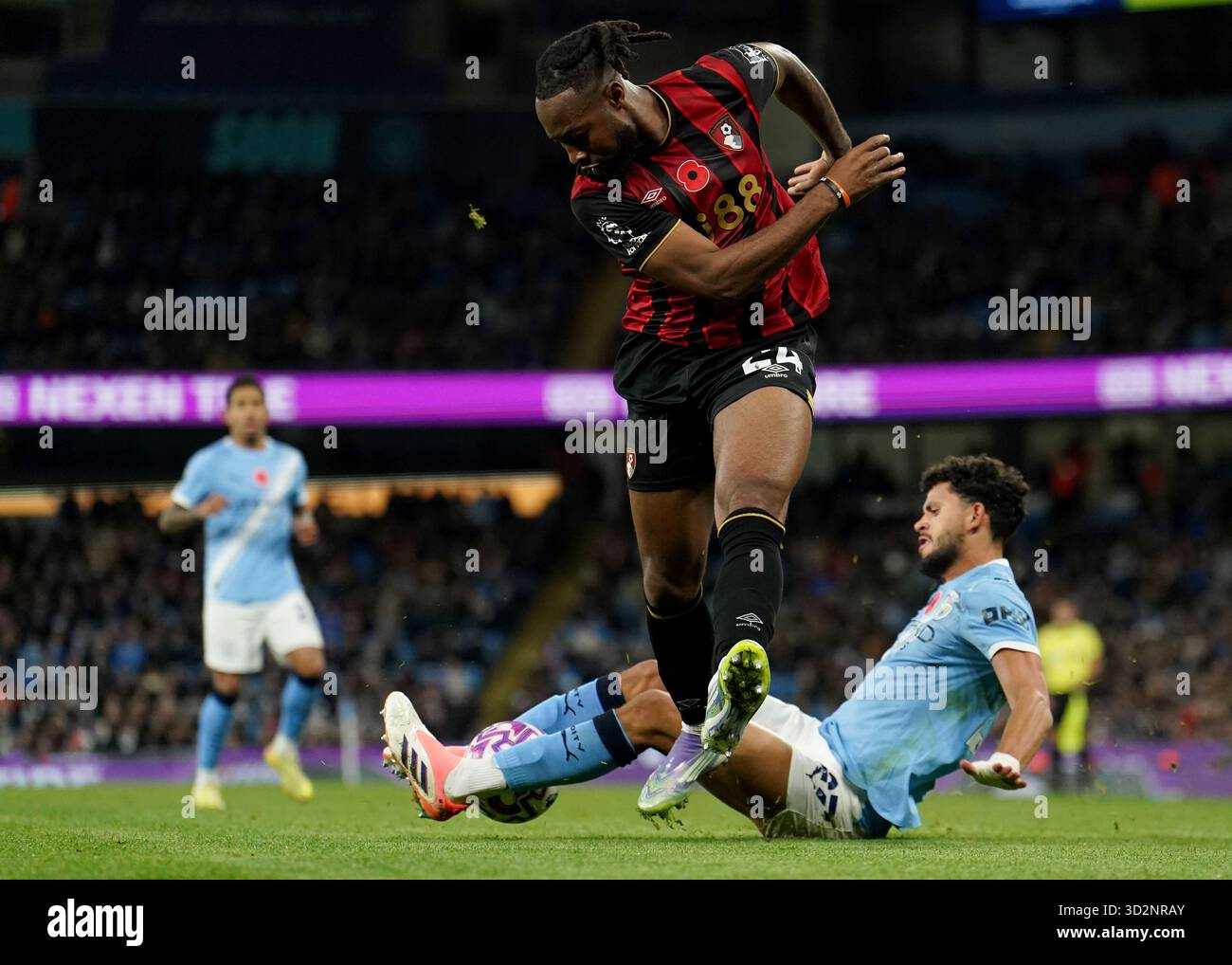 Manchester City's Matheus Nunes (bottom) and Bournemouth's Antoine ...