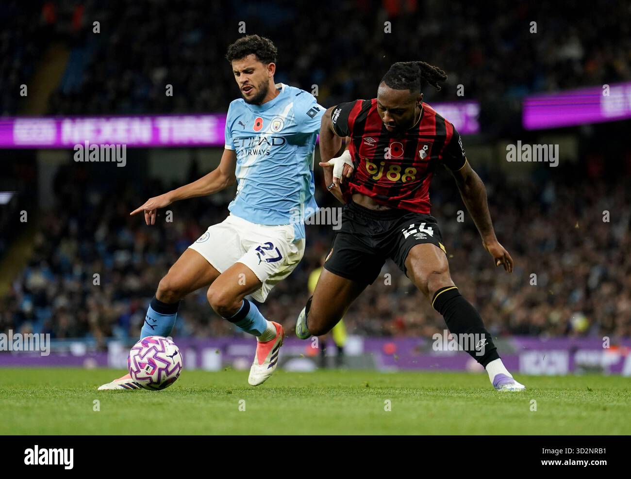 Manchester City's Matheus Nunes (left) and Bournemouth's Antoine ...