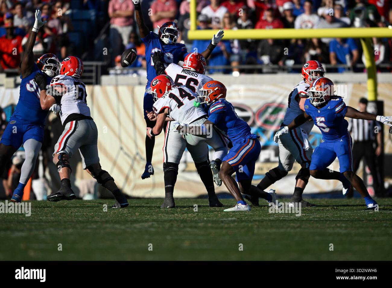 Georgia quarterback Gunner Stockton (14) is tackled by Florida safety ...
