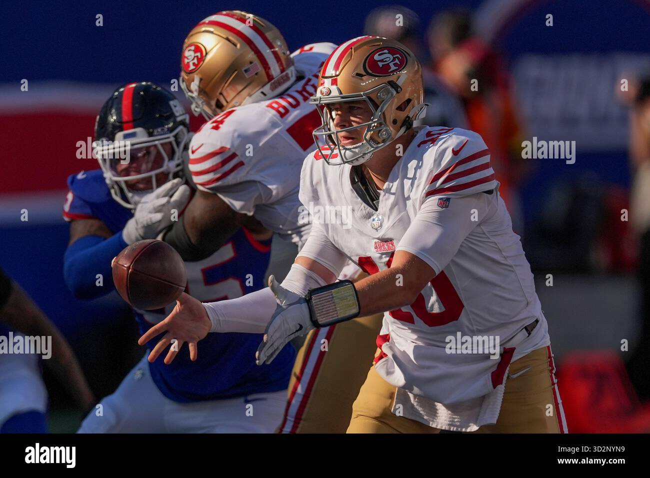 San Francisco 49ers quarterback Mac Jones (10) tosses a lateral pass ...