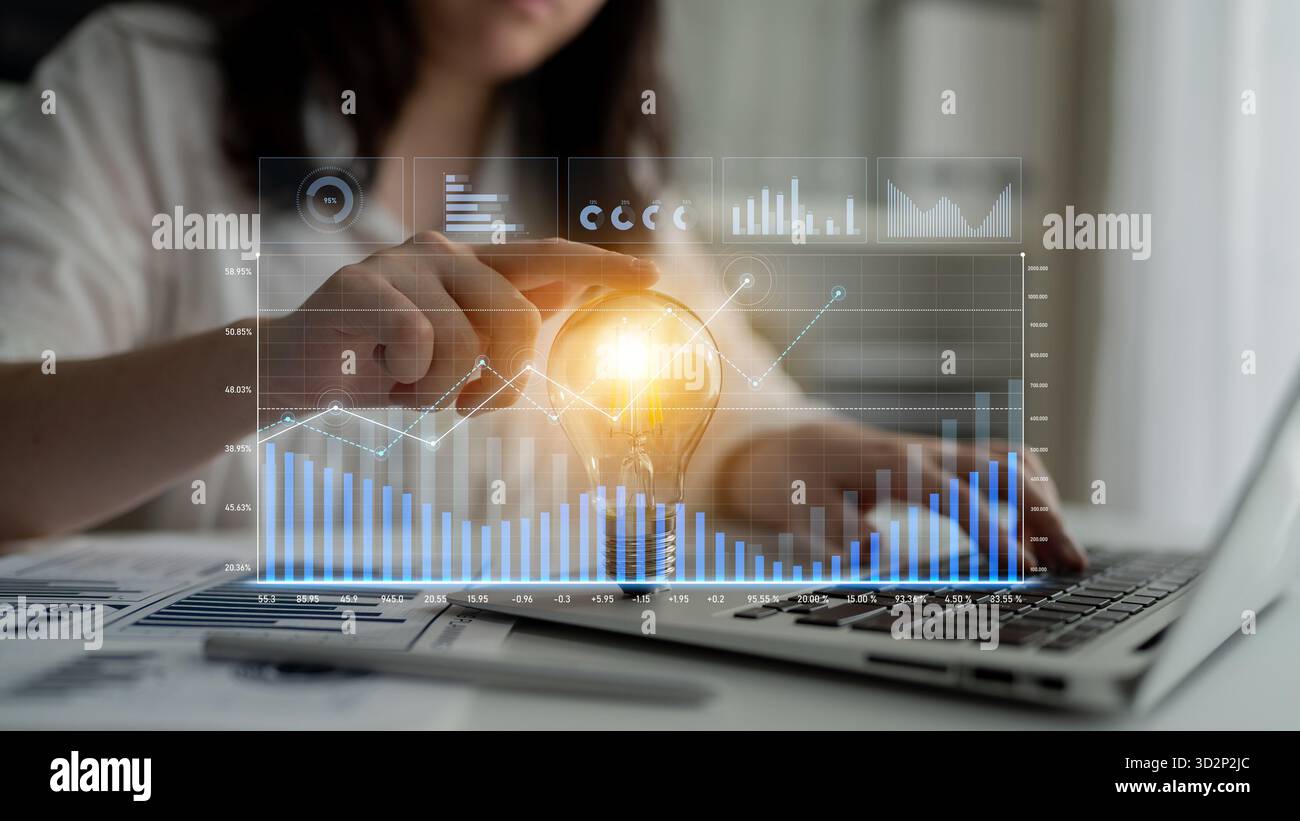 A businesswoman interacts with digital graphs and data visualizations ...