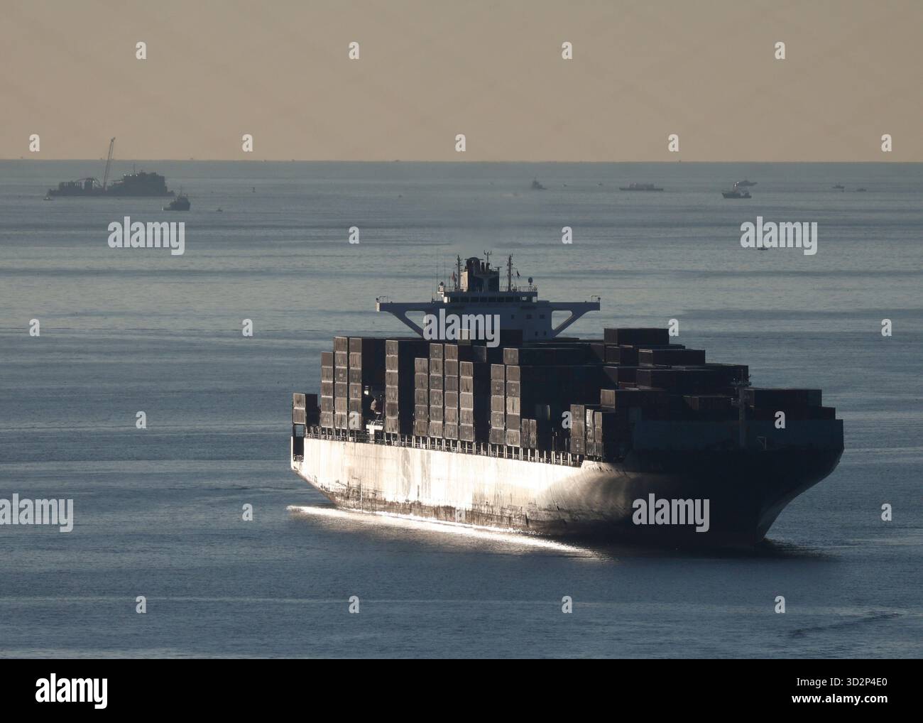 A container ship carrying cargo moves away from the Verrazzano-Narrows ...