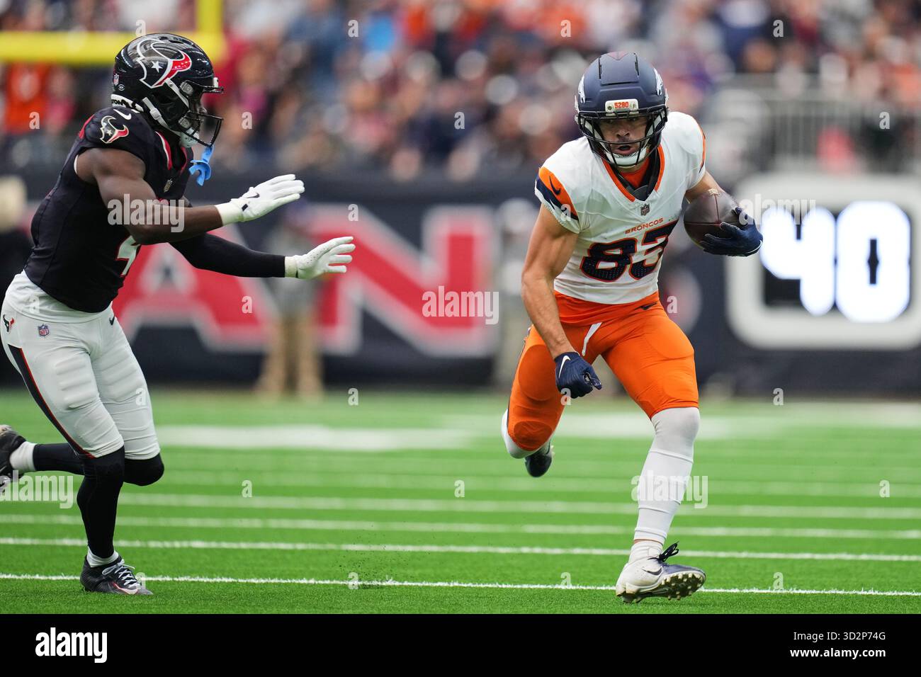 Denver Broncos wide receiver Michael Bandy (83) gains yards after a ...