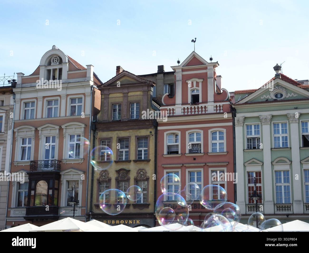 Colorful historic buildings in Poznań Old Town with bubbles - Colorful ...
