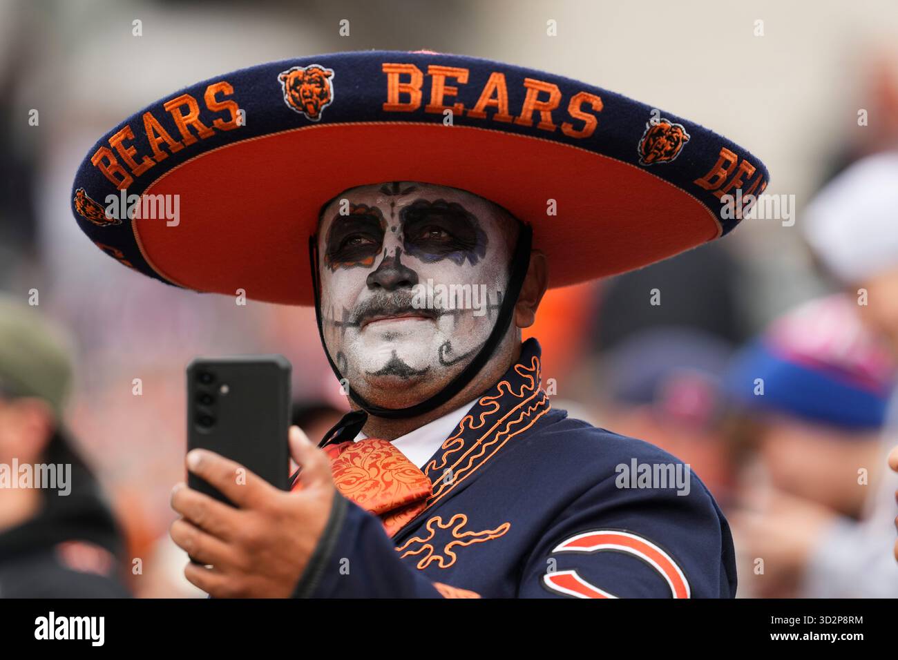 A Chicago Bears fan wears Day of the Dead makeup during the first half ...