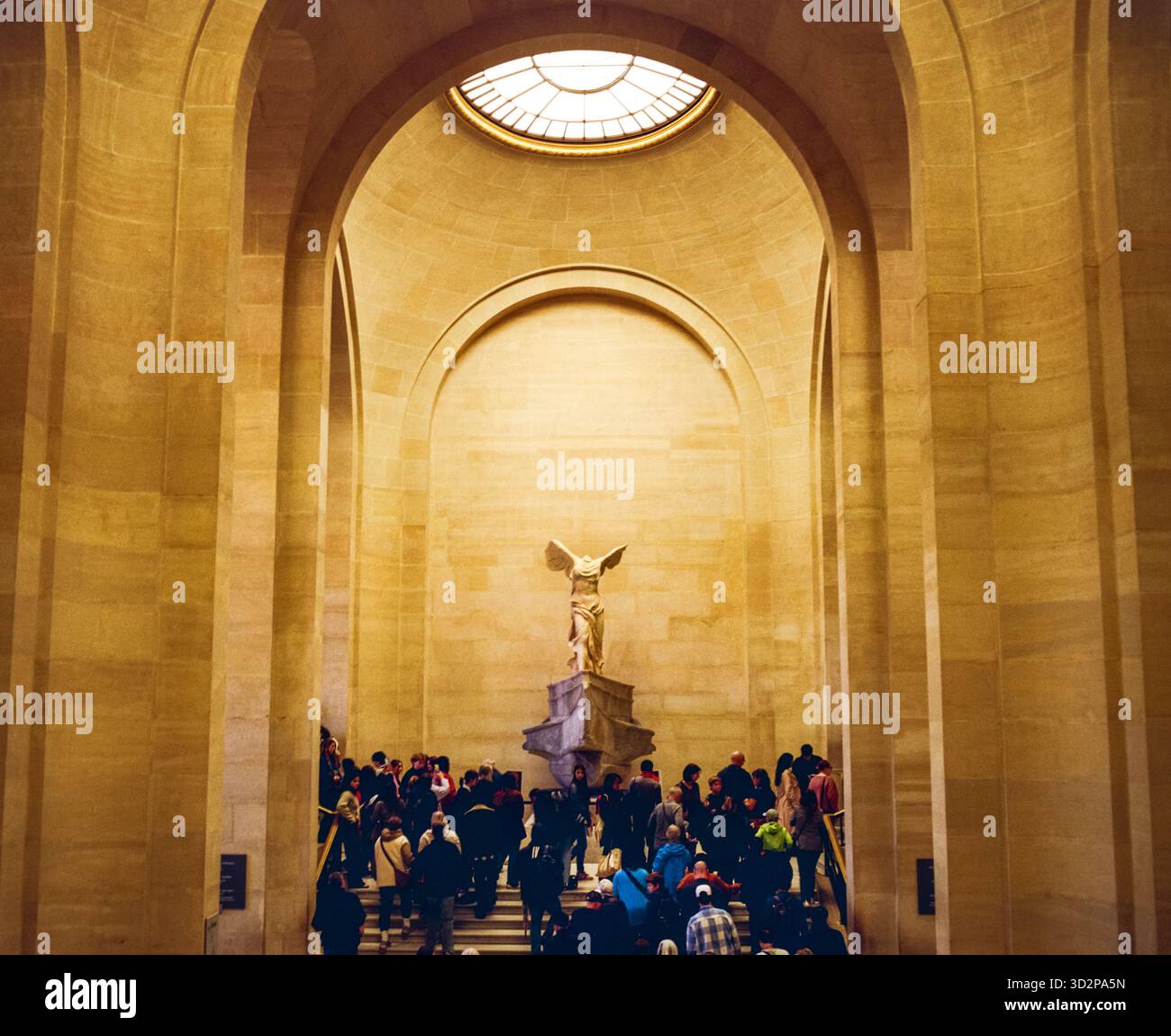 Crowd visiting the Winged Victory of Samothrace sculpture in The Louvre ...