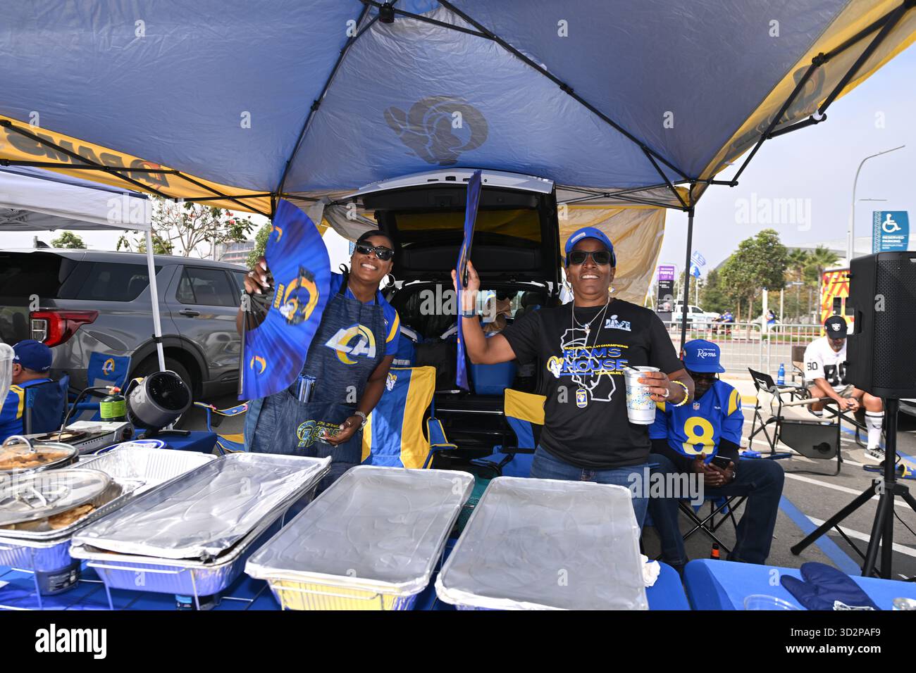 Los Angeles Rams fans pose before an NFL football game against the New ...