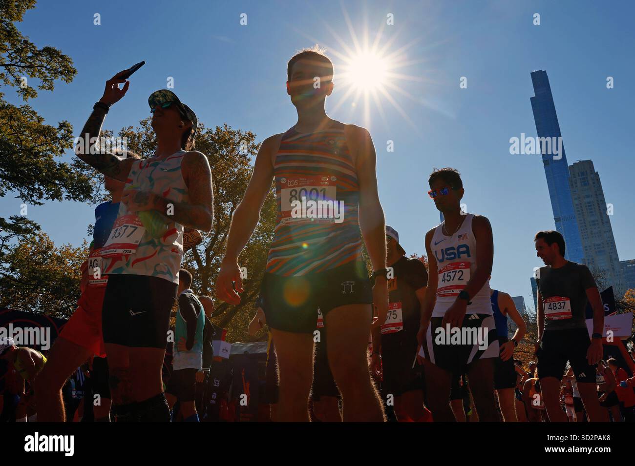 Runners cross the finish line at the 2025 NYRR TCS New York City ...