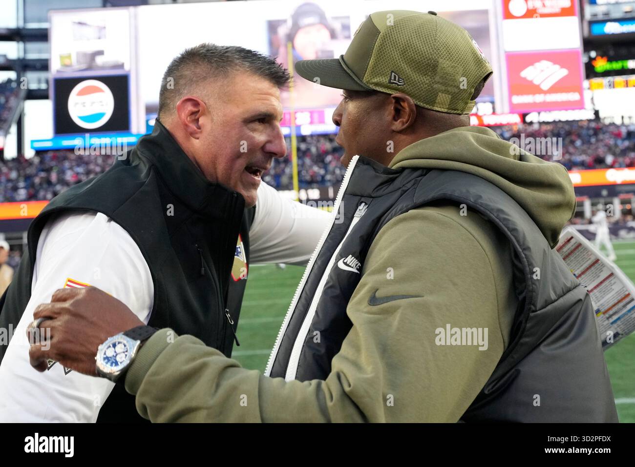 New England Patriots head coach Mike Vrabel speaks with Atlanta Falcons ...